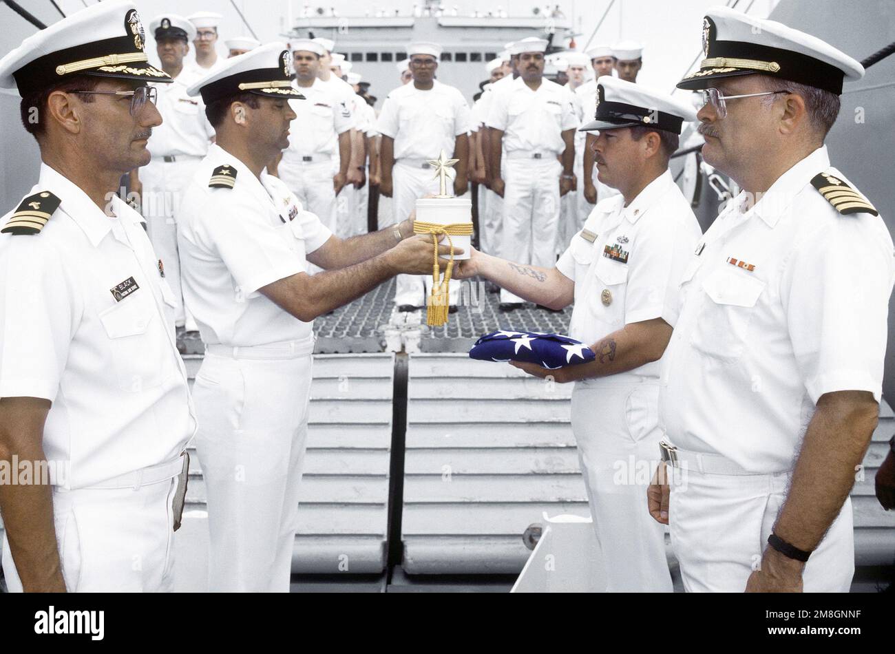 Crew members stand in formation as MCPO Charles Cartwright presents the ...