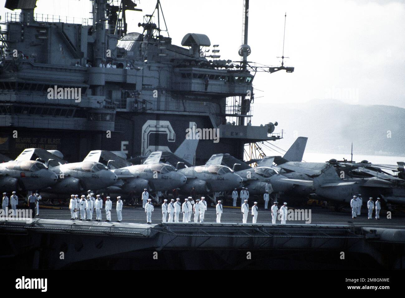 Sailors stand in formation in front of EA-6B Prowler aircraft aboard ...