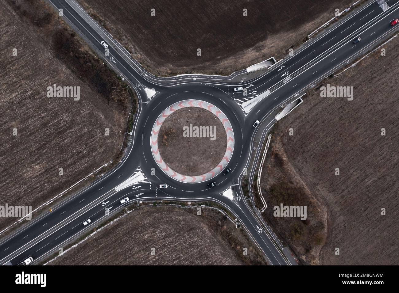 Top down view of cars driving in a roundabout Stock Photo - Alamy