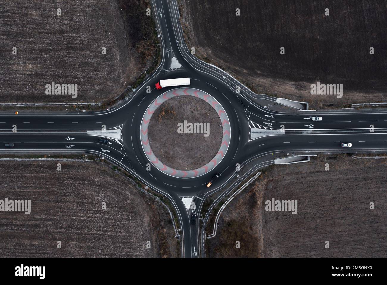 Top down view of cars driving in a roundabout Stock Photo - Alamy