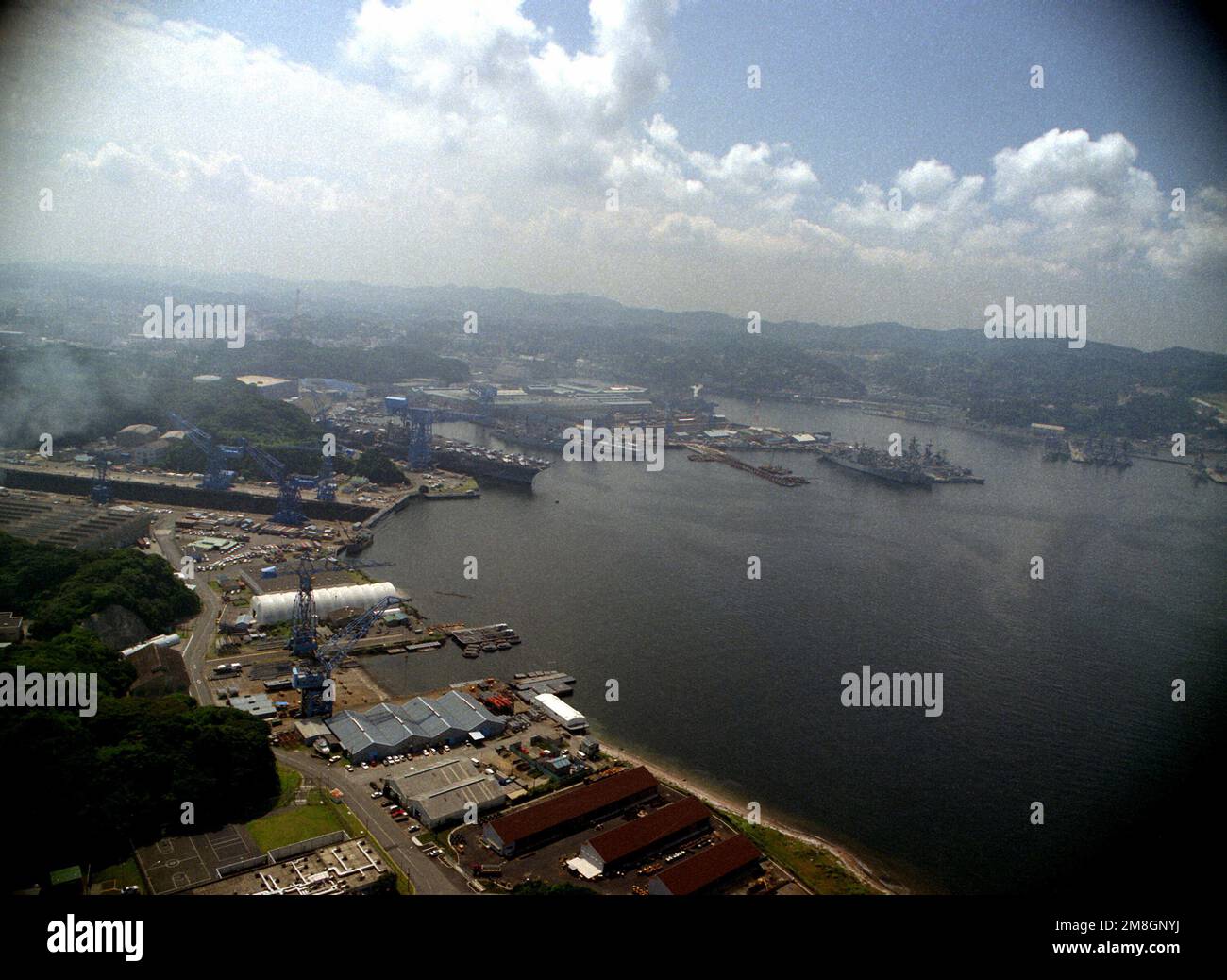An aerial view of the station, with the aircraft carrier USS RANGER (CV ...