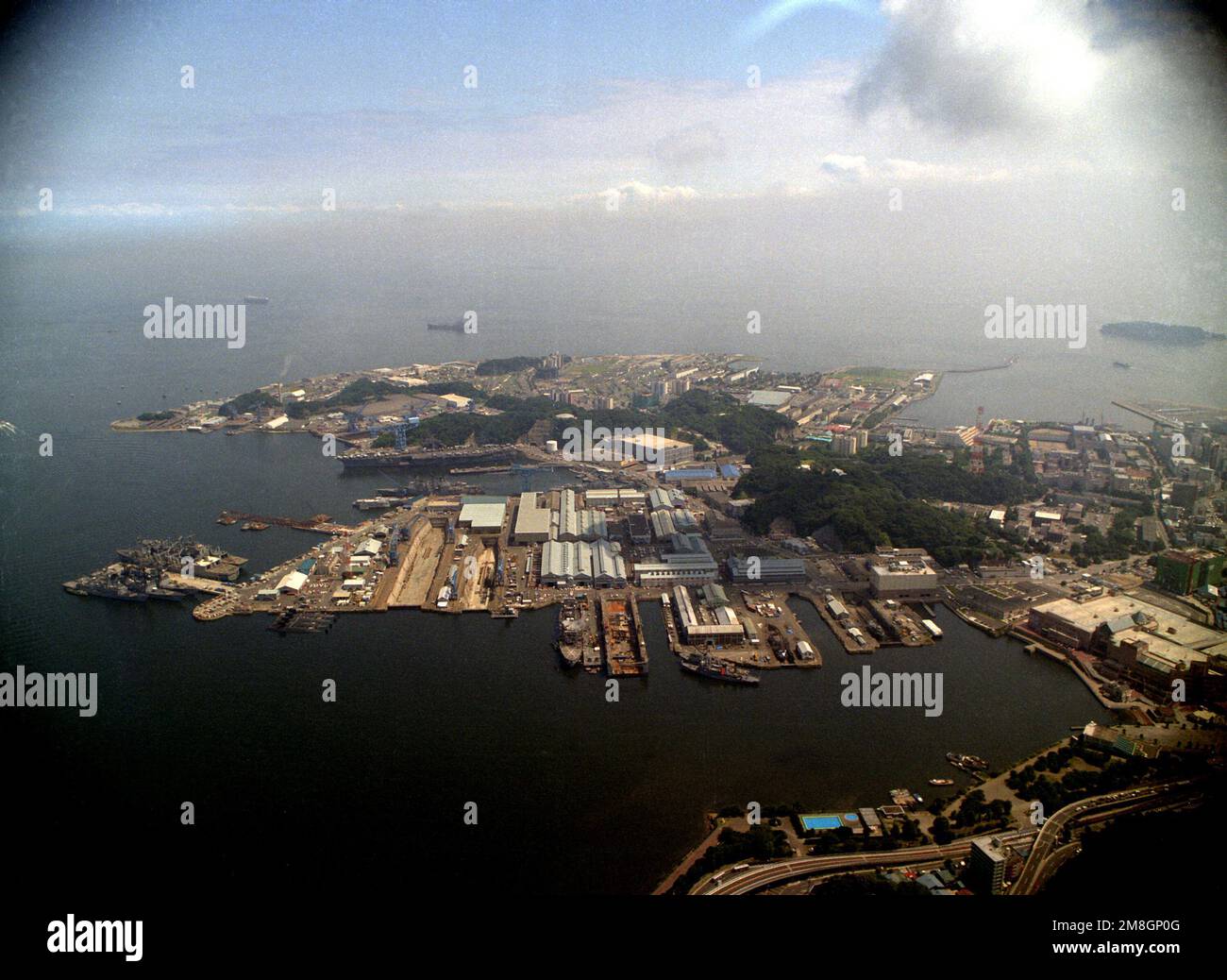 An aerial view of the station, with the aircraft carrier USS RANGER (CV ...