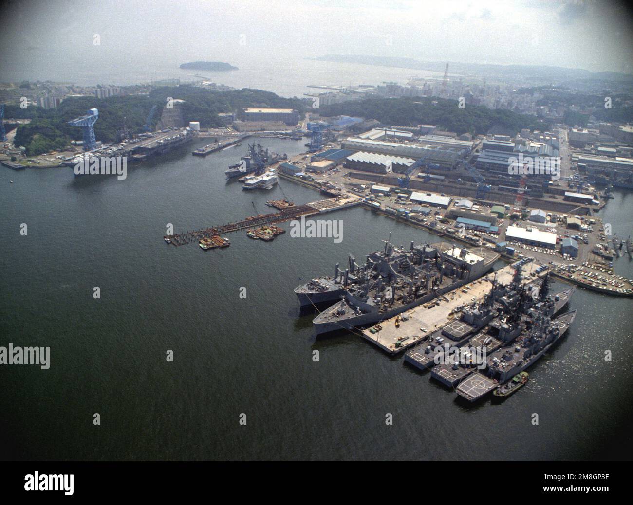 An aerial view of the station, with the aircraft carrier USS RANGER (CV ...