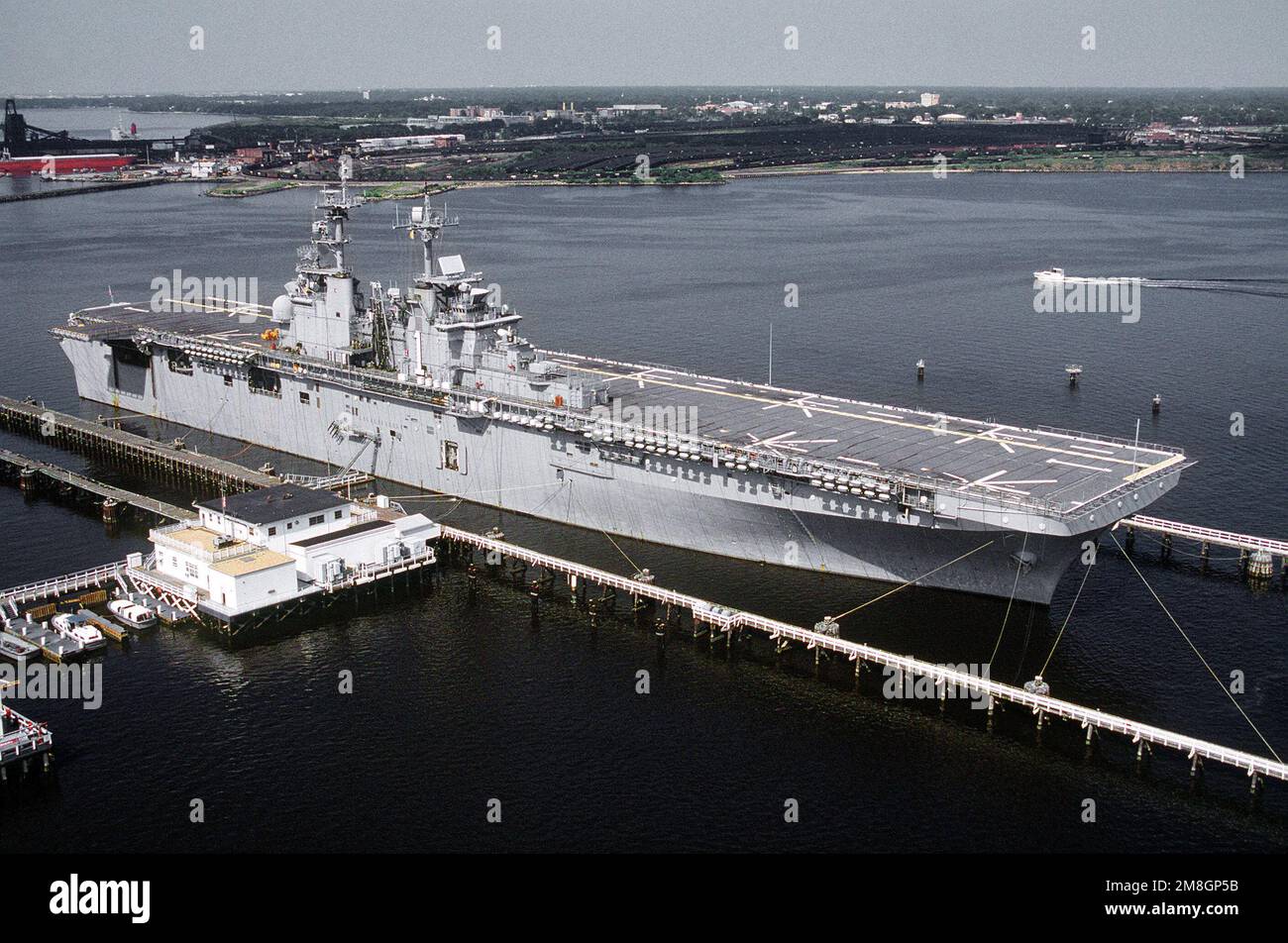 A starboard view of the amphibious assault ship USS WASP (LHD-1) moored ...