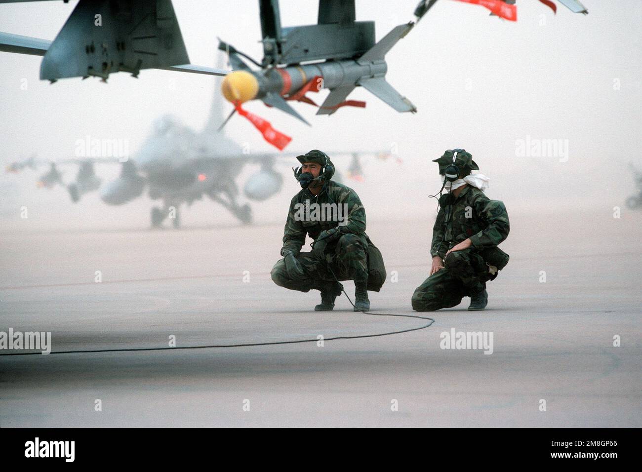 Two ground crewmen watch as 4th Tactical Fighter Wing (Provisional) F ...