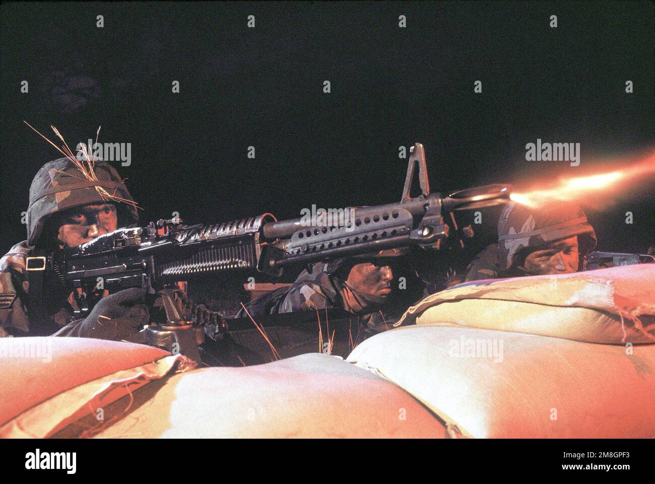 An Air Force team member fires a 7.62mm M-60 machine gun during ...