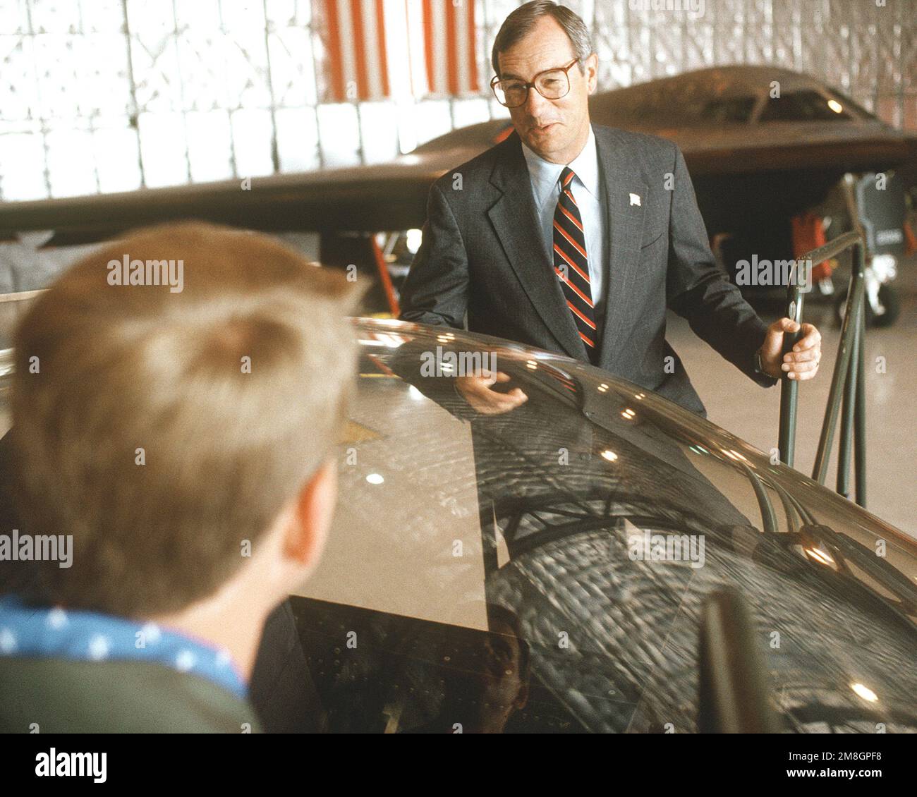 Secretary of the Air Force Donald B. Rice converses with an aircrew ...