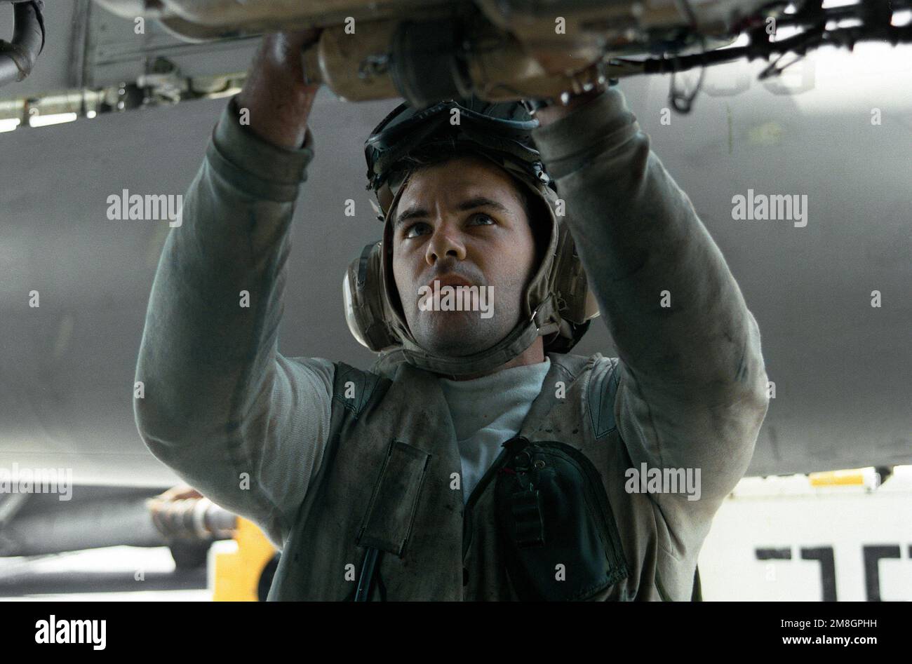 Aviation Machinist's Mate 3rd Class Steven Fowler, a jet engine ...