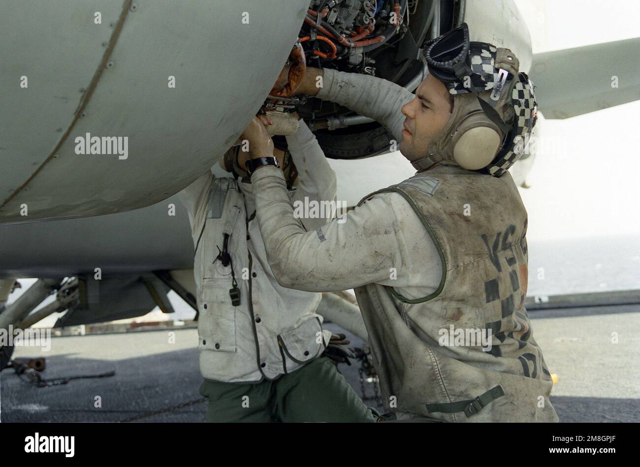 Aviation Machinist's Mate 3rd Class Steven Fowler, a jet engine ...