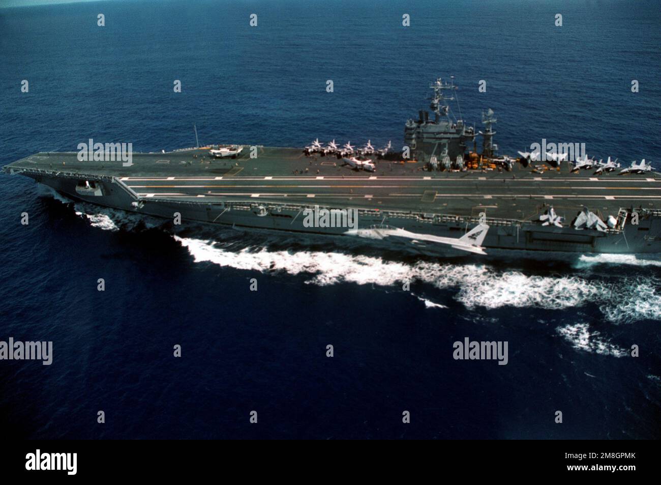 A port side view of the nuclear-powered aircraft carrier USS GEORGE ...