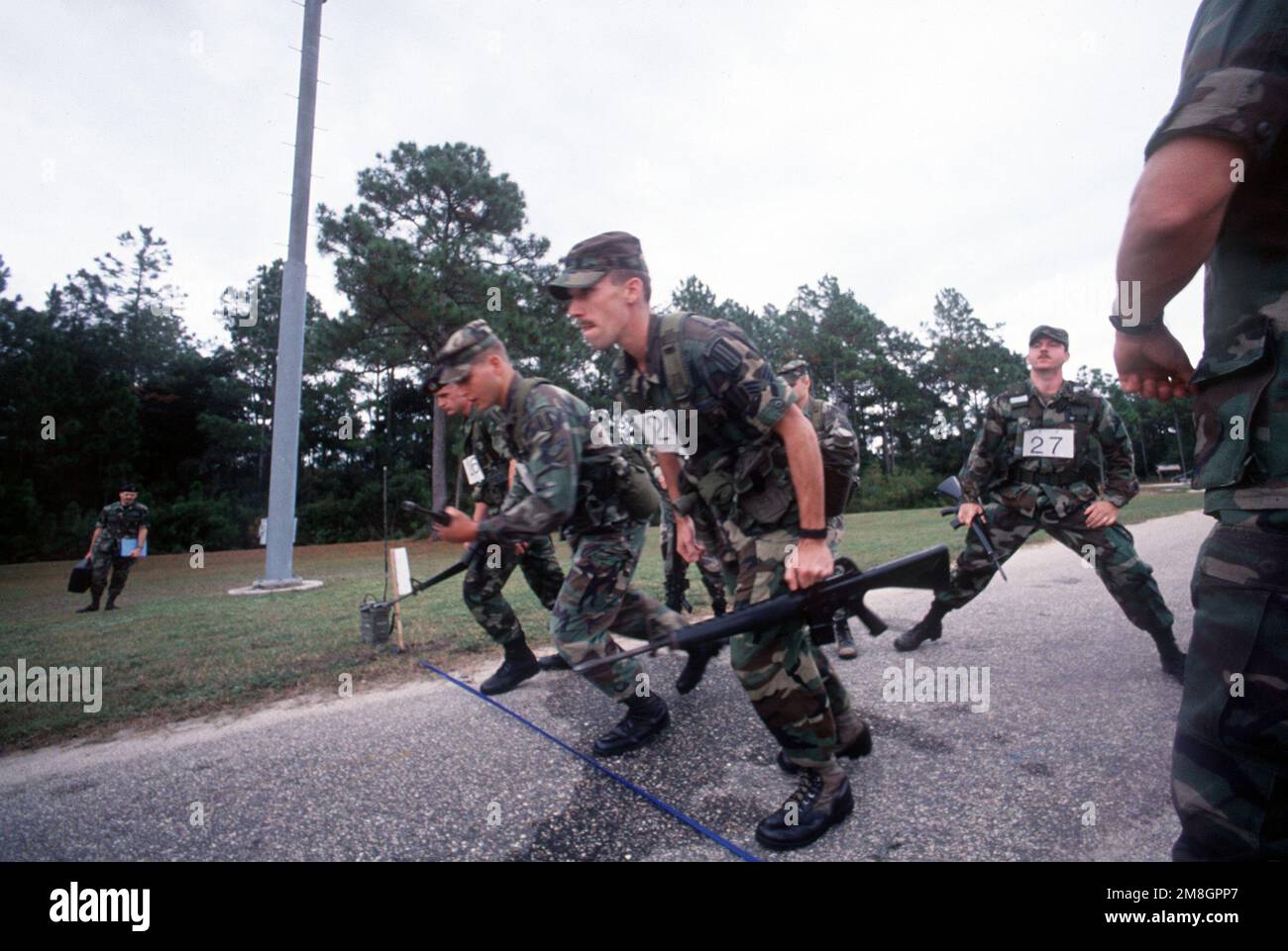 Participants in the three-mile combat run begin the race during Combat ...