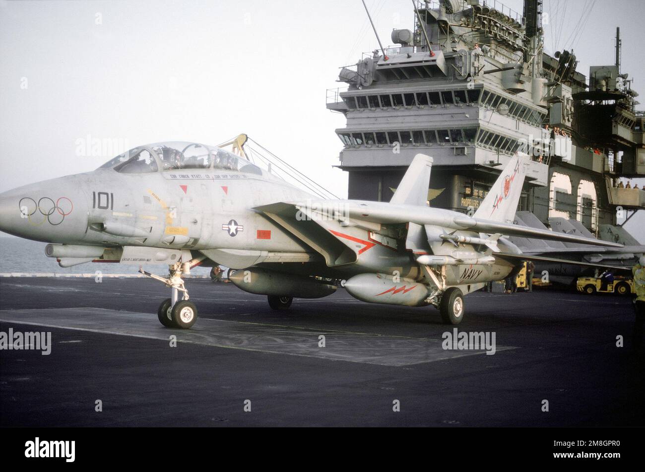 The pilot of a Fighter Squadron 74 (VF-74) F-14B Tomcat aircraft waits for instructions on the ...