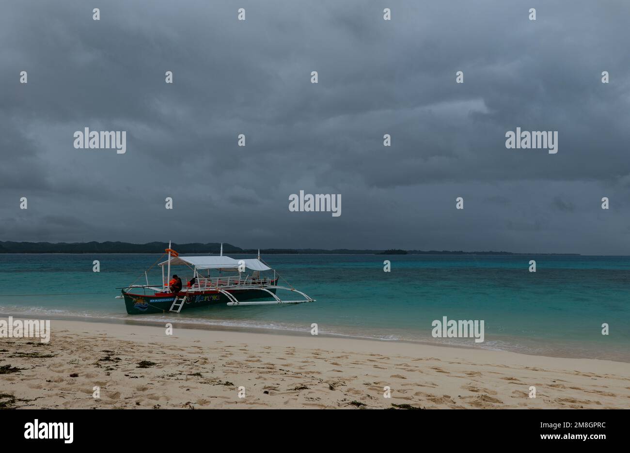 Catamarans on the beach in Siargao Island, Philippines, cloudy day Stock Photo - Alamy