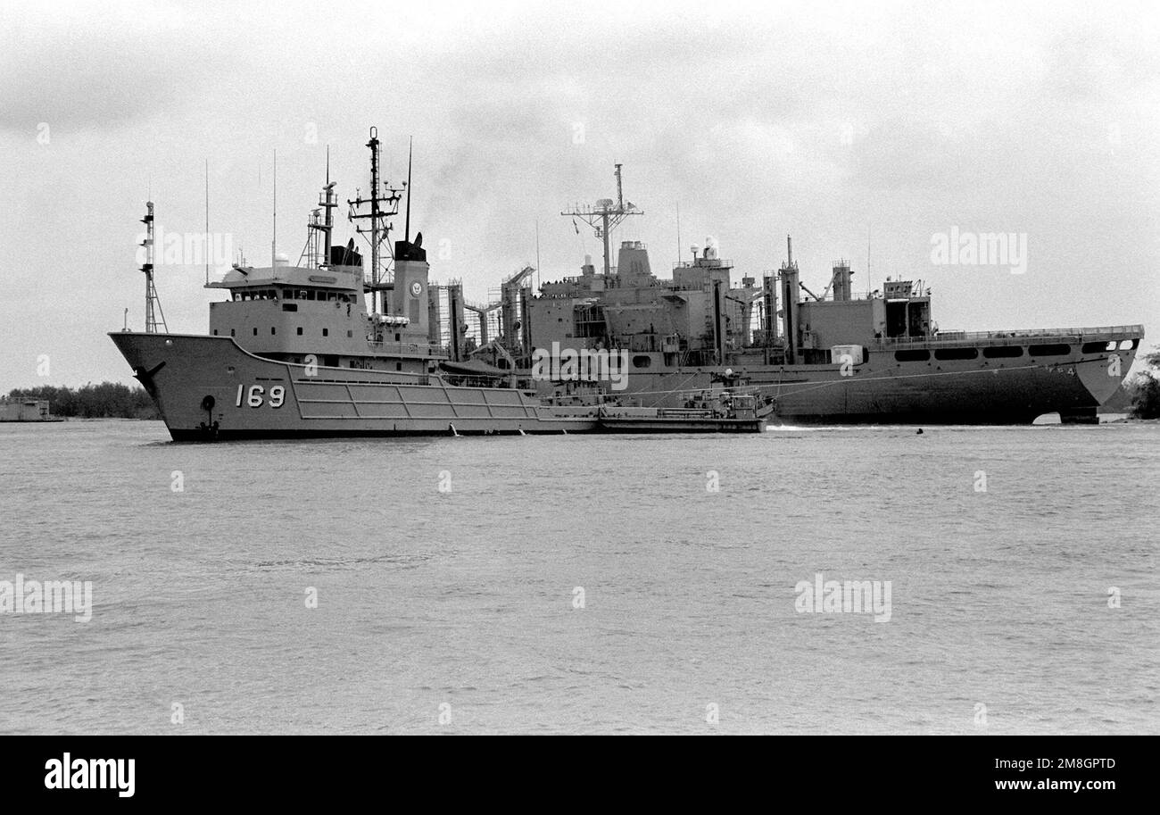 The fleet ocean tug USNS NAVAJO (T-ATF-169) tows the combat stores ship ...