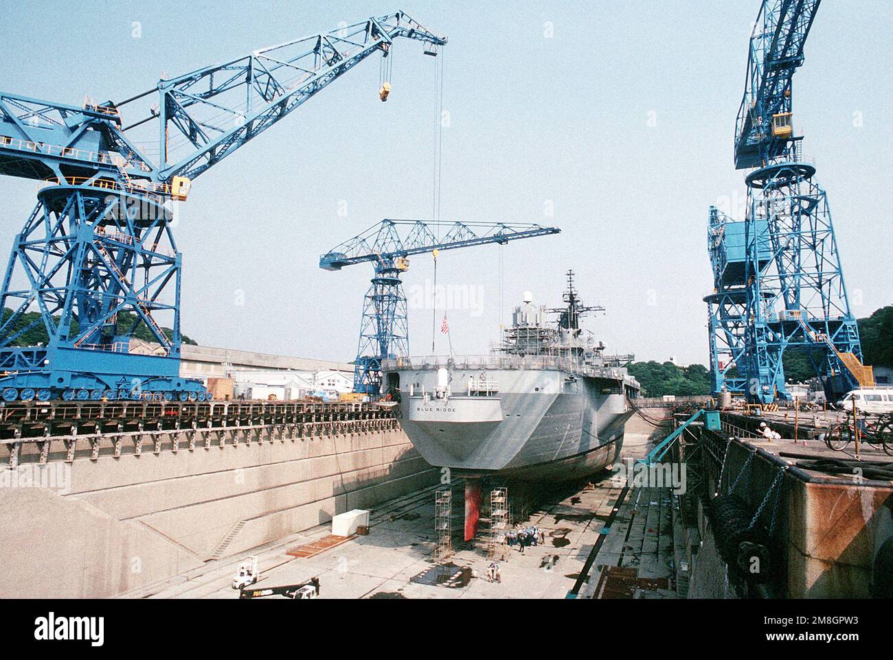 A starboard quarter view of the amphibious command ship USS BLUE RIDGE ...