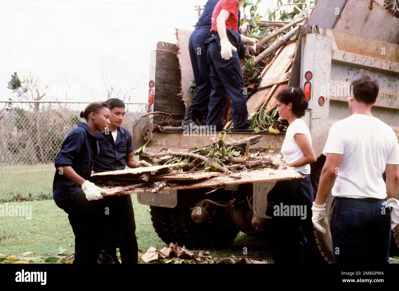 Naval personnel from Naval Air Station, Agana, take part in clean-up ...