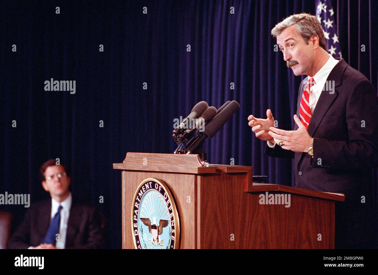 Acting Secretary of the Navy Sean O'Keefe speaks with members of the ...