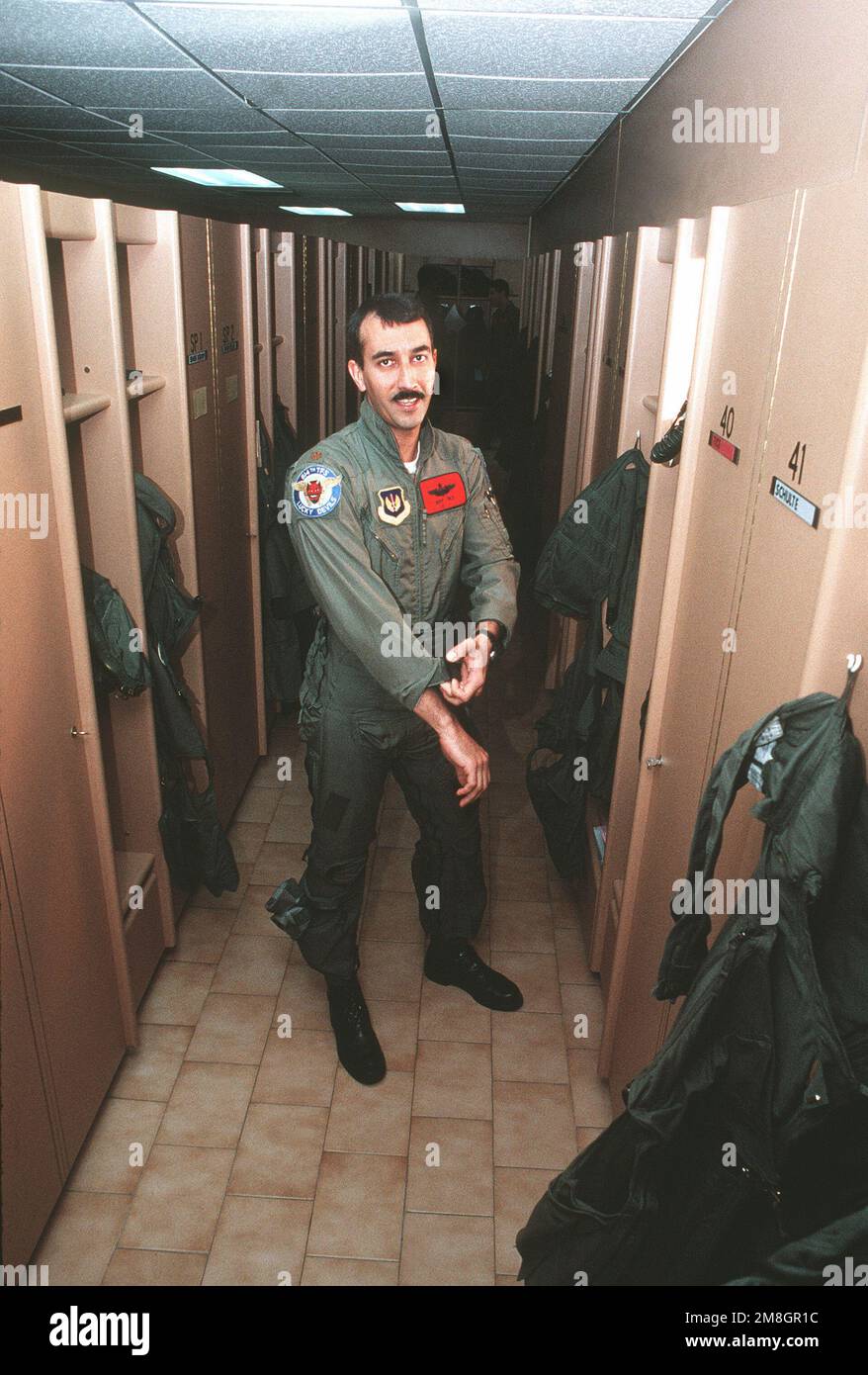 614th Tactical Fighter Squadron F-16 Fighting Falcon pilot MAJ Jeffrey Tice adjusts his flight ...