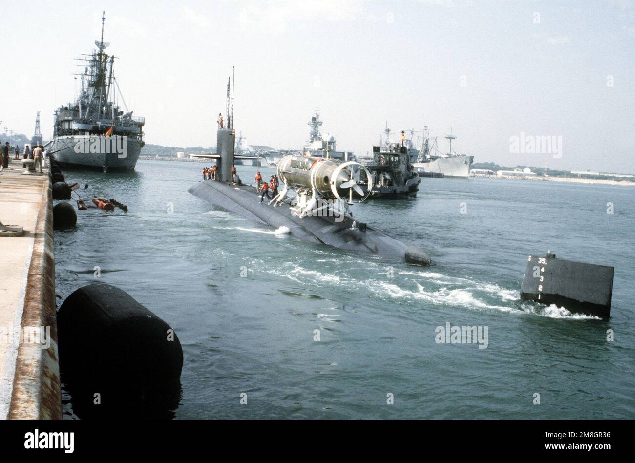 Crewmen on the deck of the nuclear-powered attack submarine USS ...