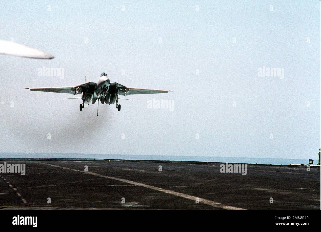 A Fighter Squadron 21 (VF-21) F-14 Tomcat aircraft approaches the ...
