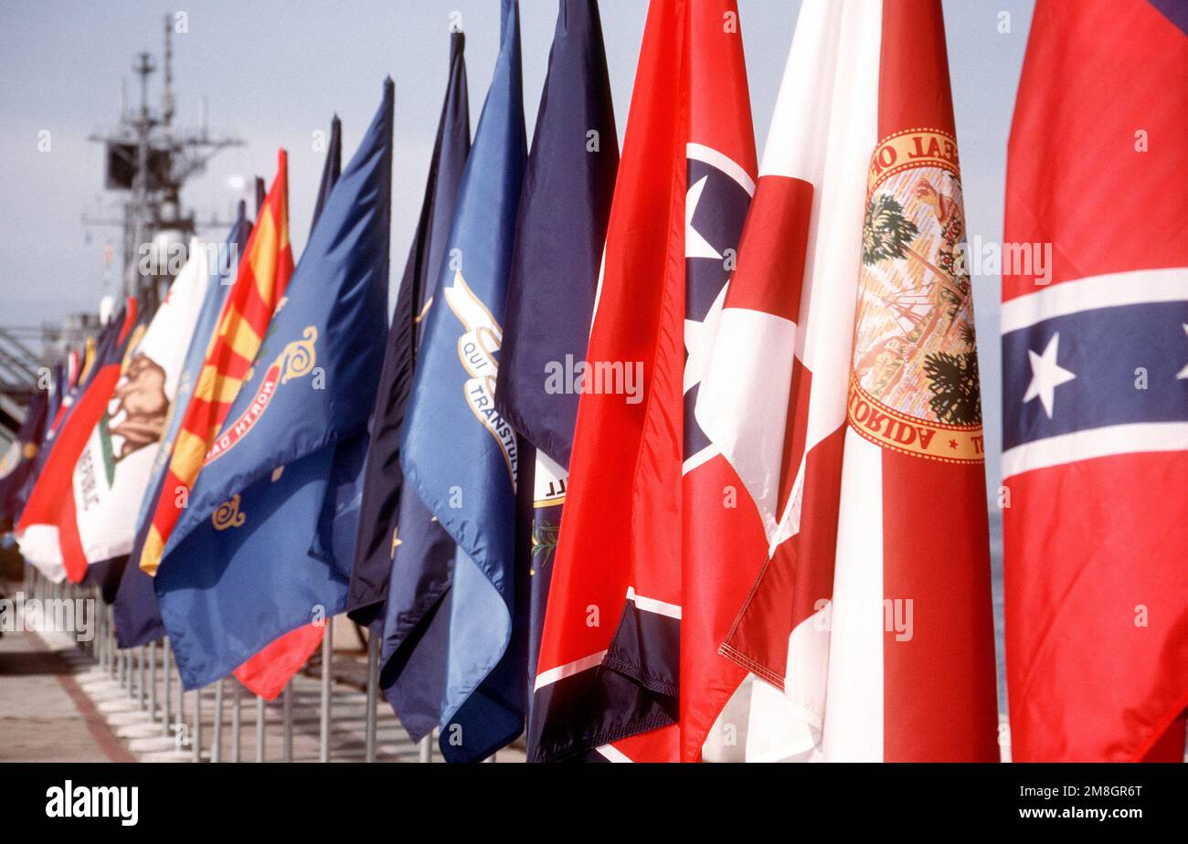State flags decorate the pier as the guided missile cruiser USS SHILOH ...