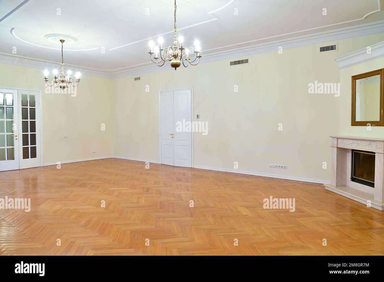 huge empty room without furniture with laminate flooring and high ...