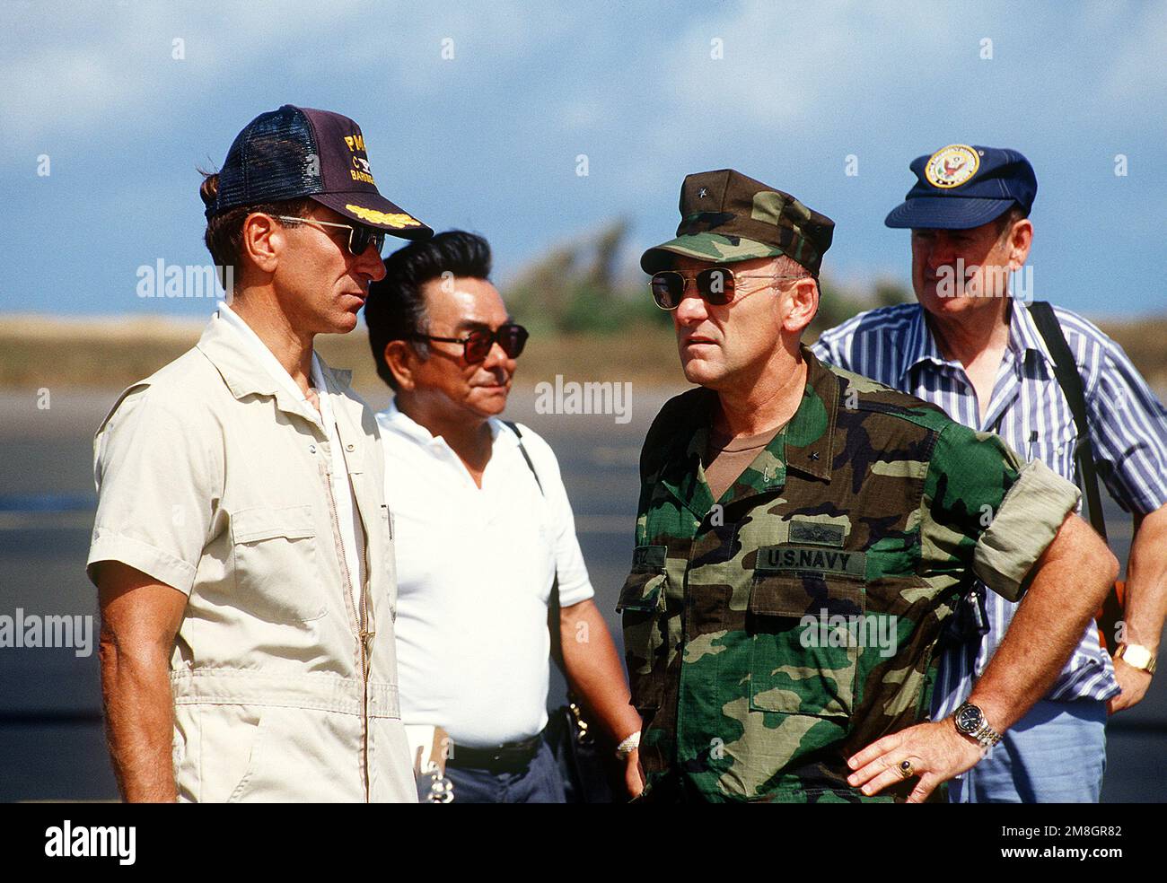 Military and civilian officials discuss damage to the Pacific Missile ...