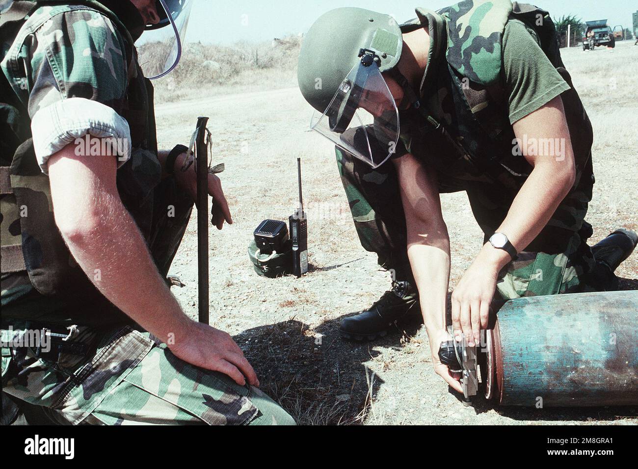 Navy EOD (explosive ordnance disposal) personnel conduct a training ...