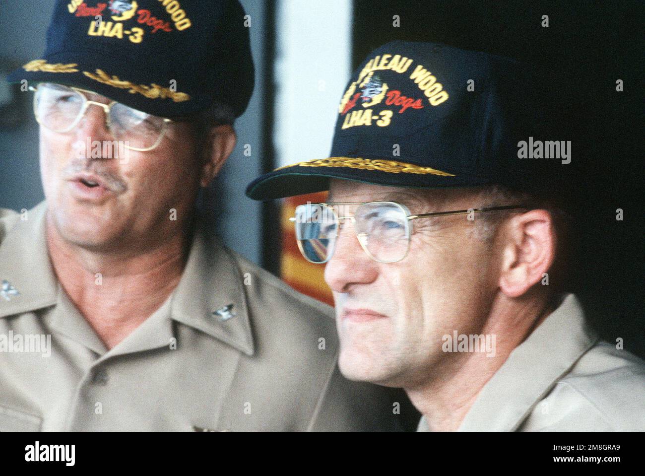 CAPT Douglas Bradt, left, commanding officer of the amphibious assault ...