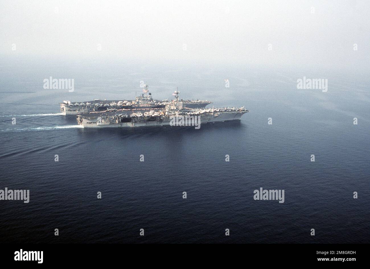 A starboard view of the aircraft carriers USS INDEPENDENCE (CV-62) and ...