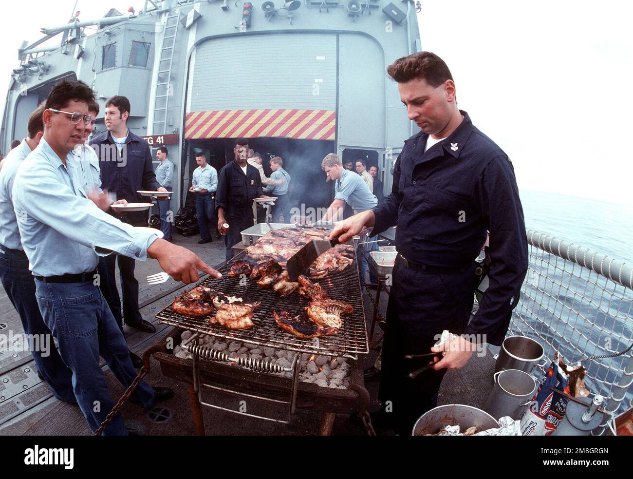 Crew members aboard the guided missile frigate USS MCCLUSKY (FFG-41 ...