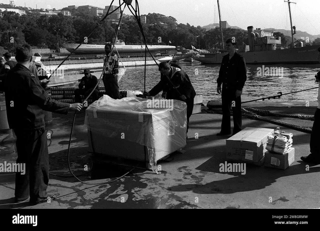 Russian sailors remove the hoisting cables from a pallet of Project ...