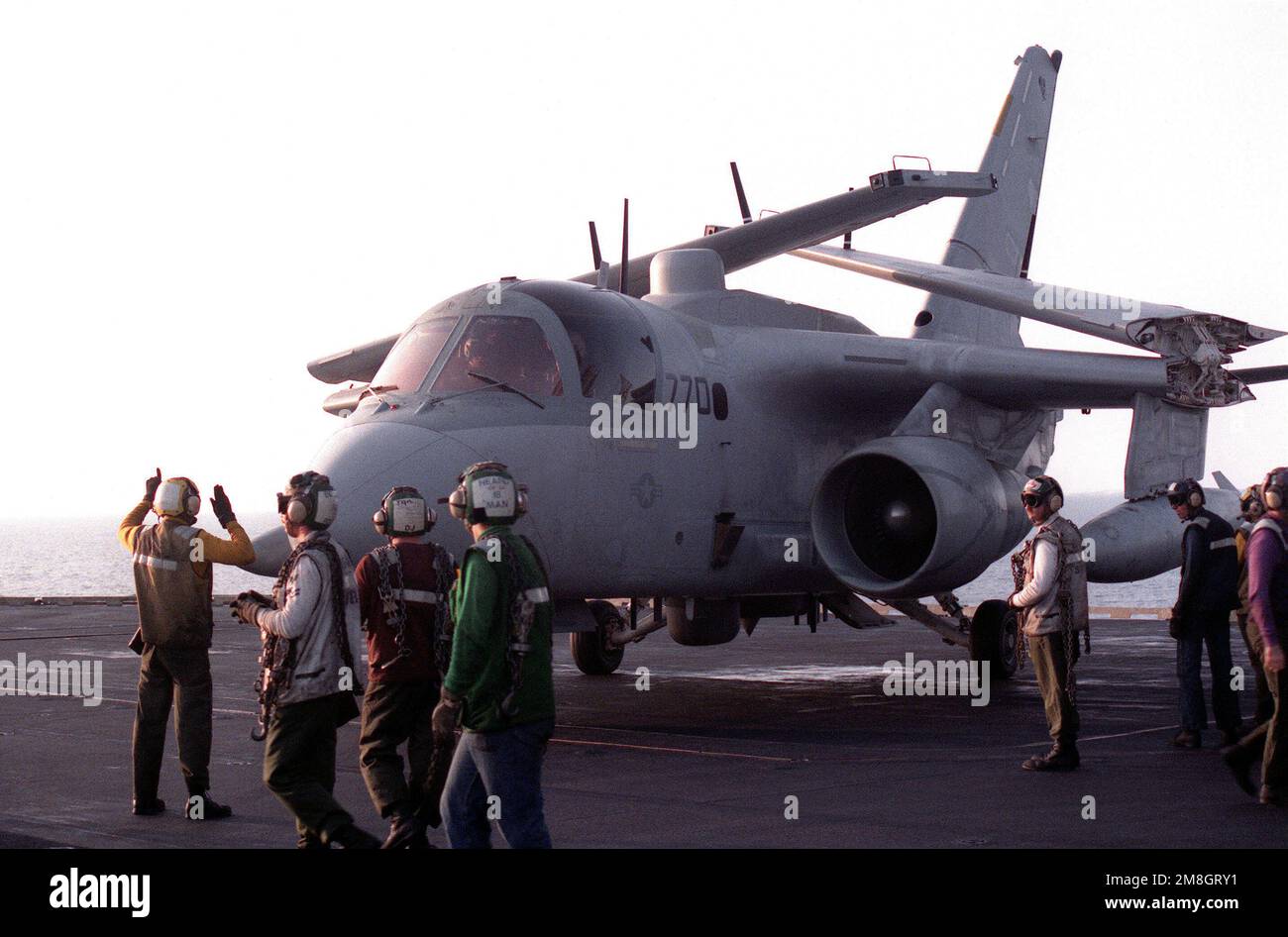 Flight deck personnel prepare to secure an Air Test and Evaluation ...