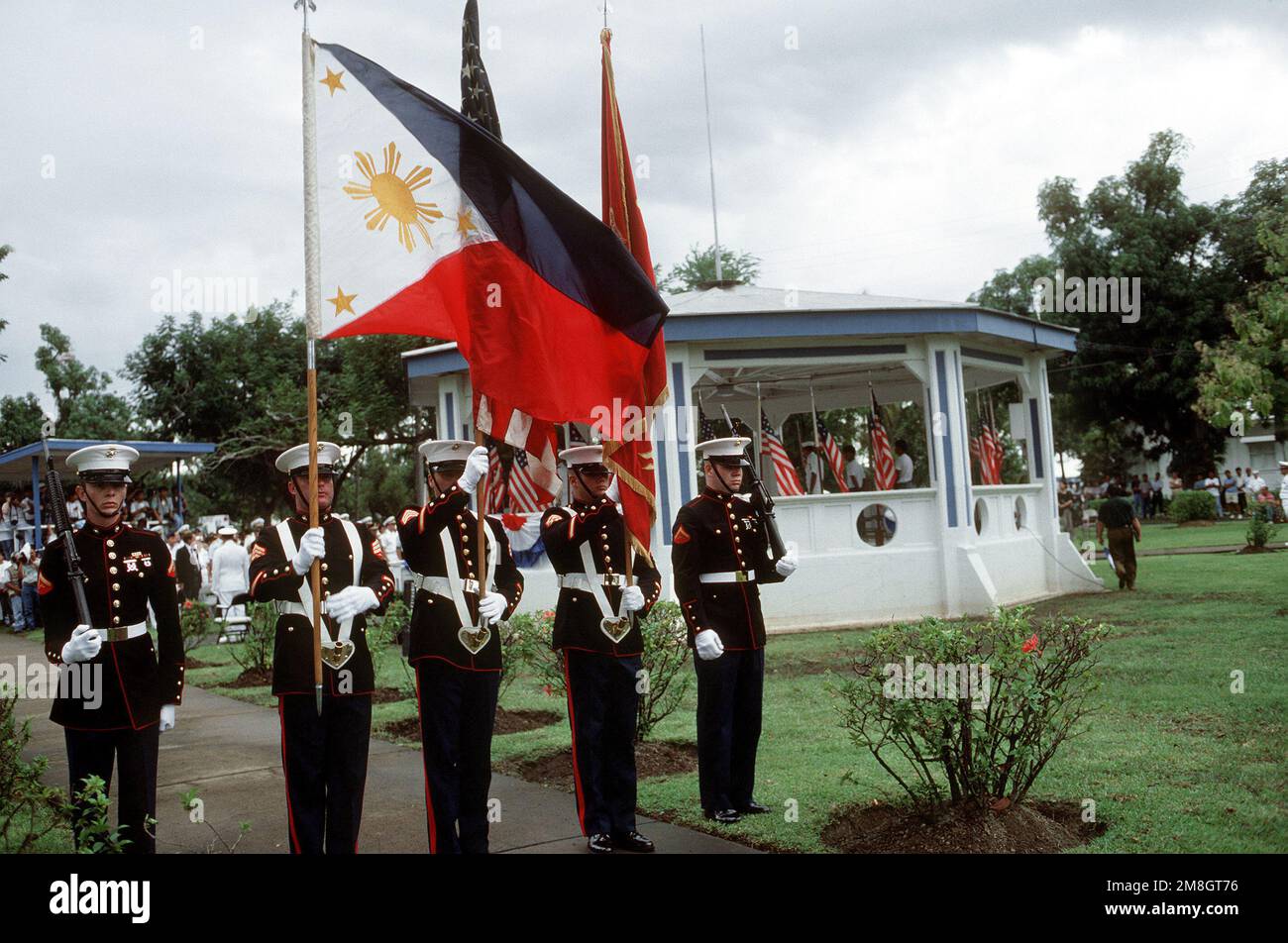 A Marine color guard displays the colors at the conclusion of the ...