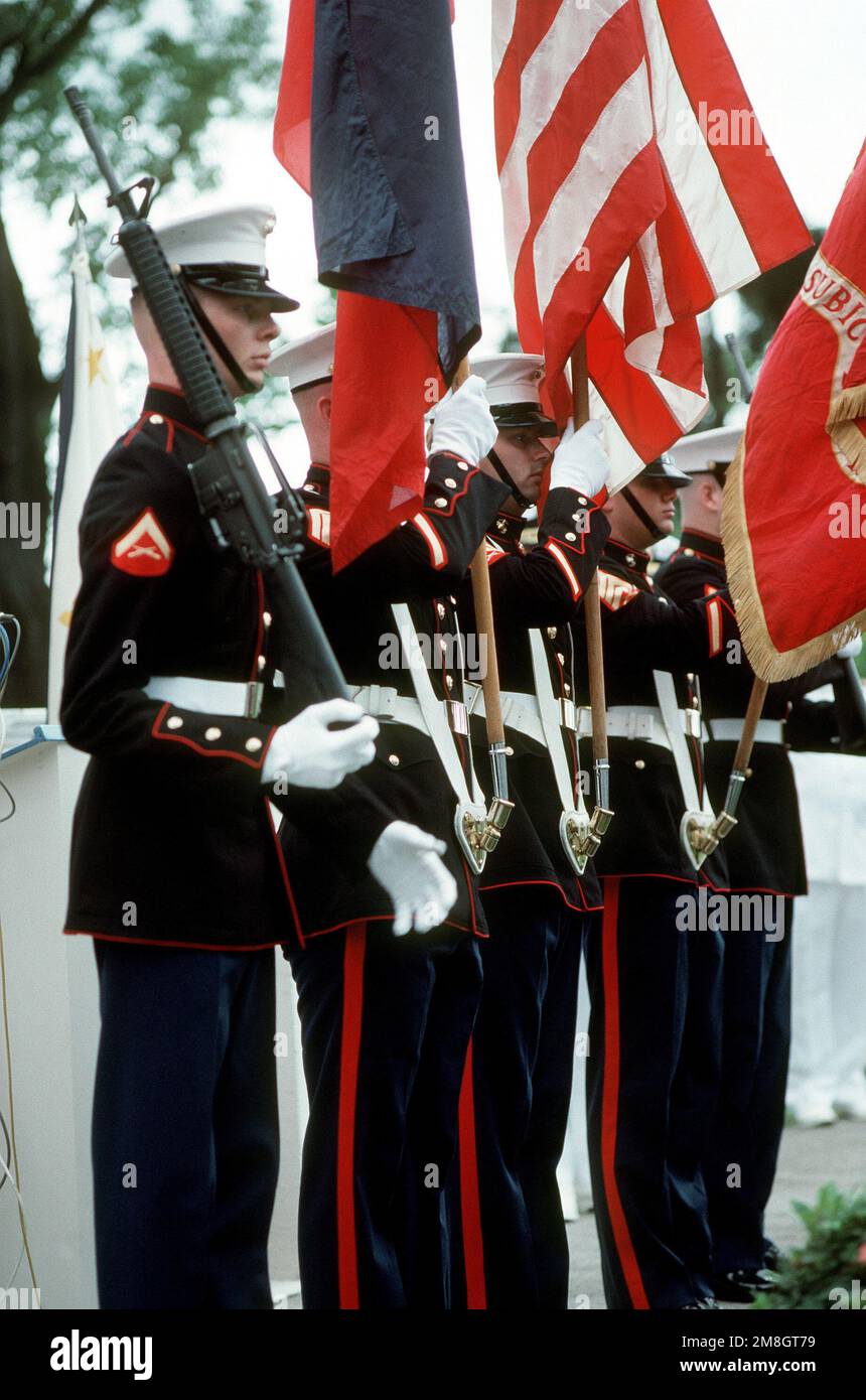 A Marine color guard stands at attention during the deactivation ...