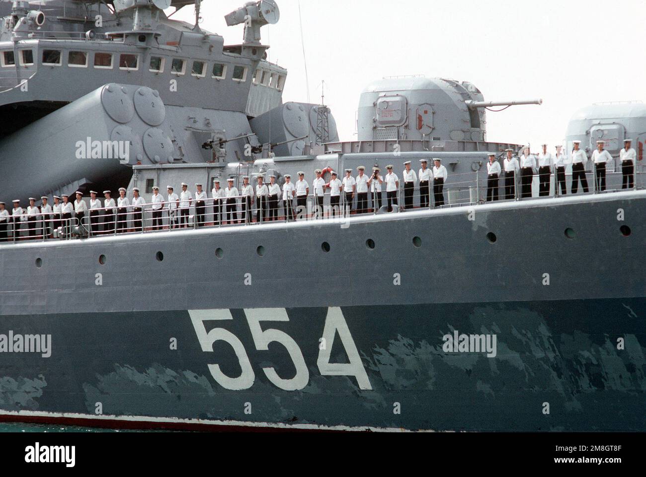 Crewmen man the rails of the Russian guided missile destroyer ADMIRAL ...