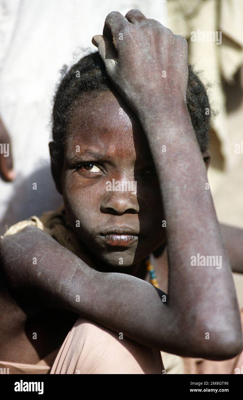 A close up view of a Somalian refugee woman as she waits for relief ...