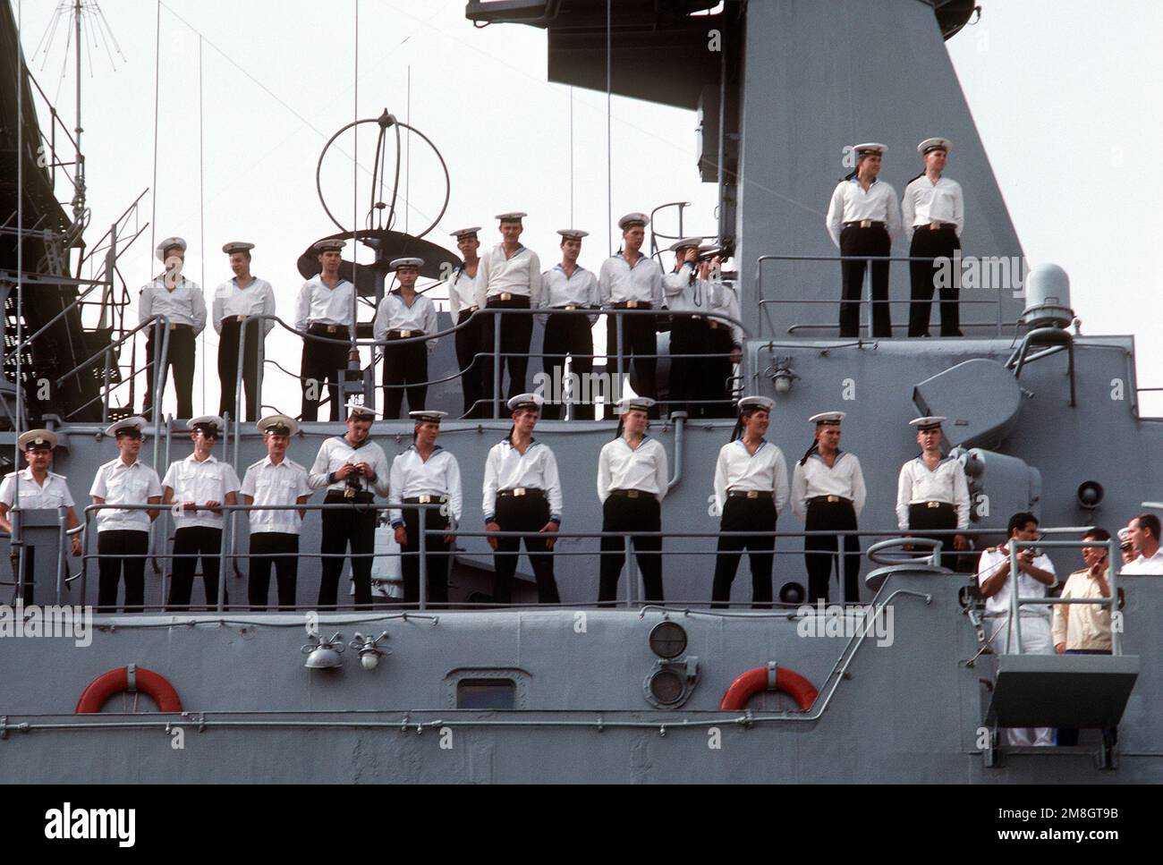 Crewmen man the rails of the Russian guided missile destroyer ADMIRAL ...
