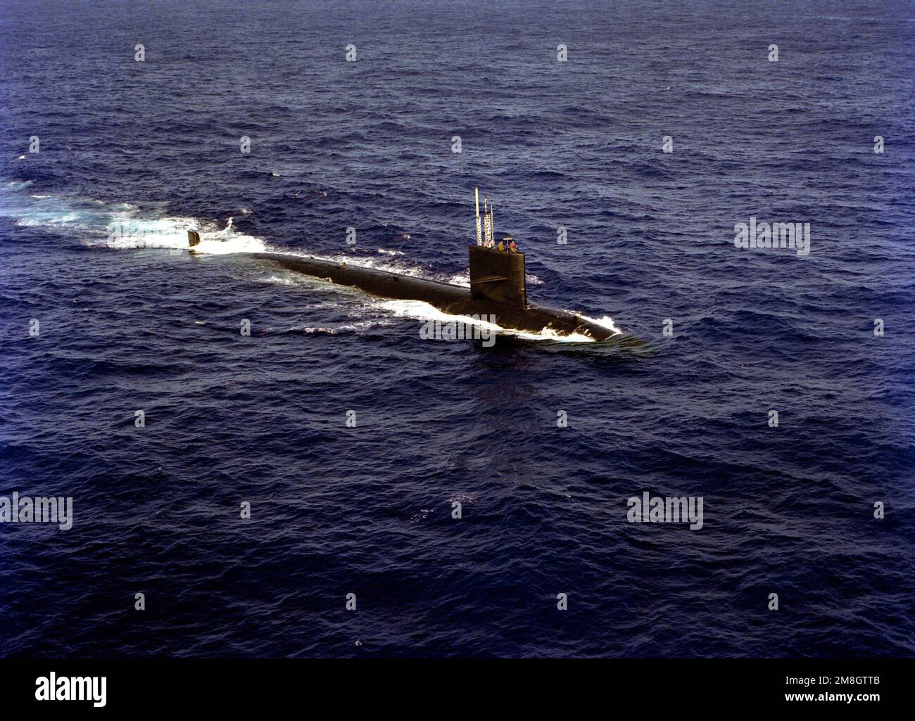 A starboard bow view of the nuclear-powered attack submarine USS ...