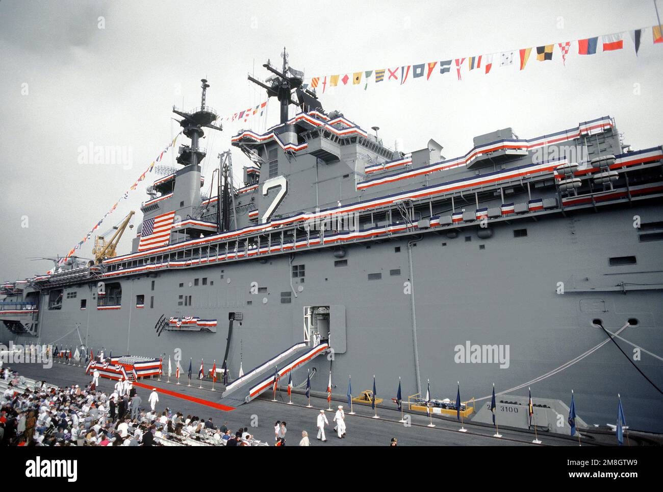 Bunting bedecks the amphibious assault ship USS ESSEX (LHD-2) as it ...