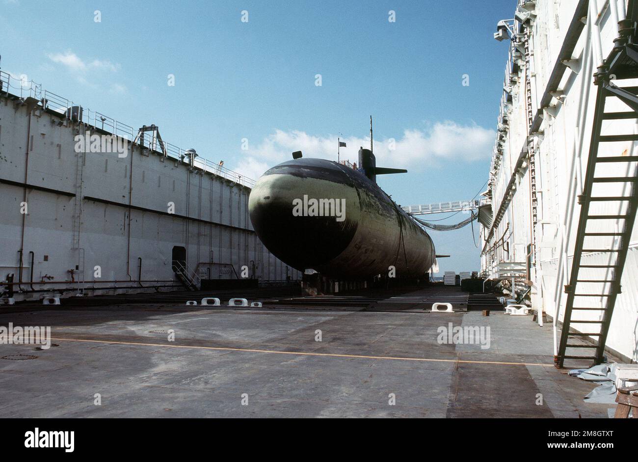 A port bow view of the nuclear-powered attack submarine USS MEMPHIS (SSN-691) secured in the ...