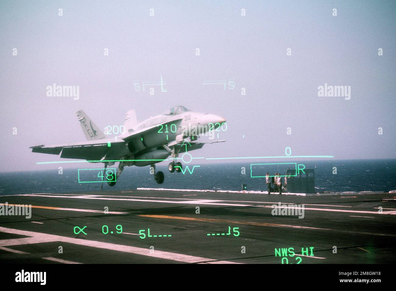 A Strike Fighter Squadron 136 (VFA-136) F/A-18C Hornet aircraft lands ...