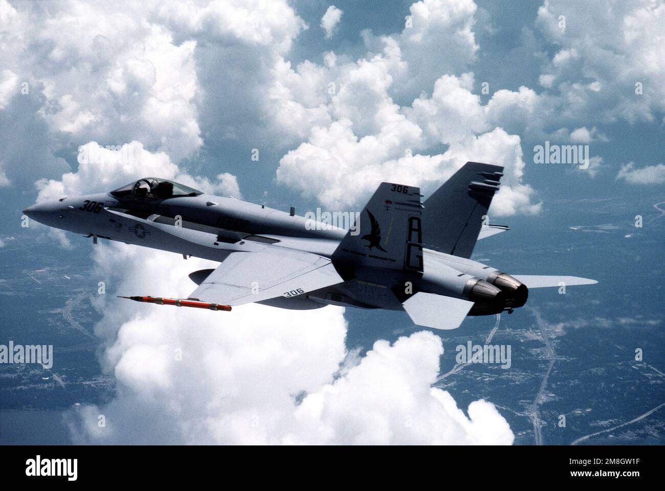 An air-to-air, left side view of a Strike Fighter Squadron 136 (VFA-136 ...