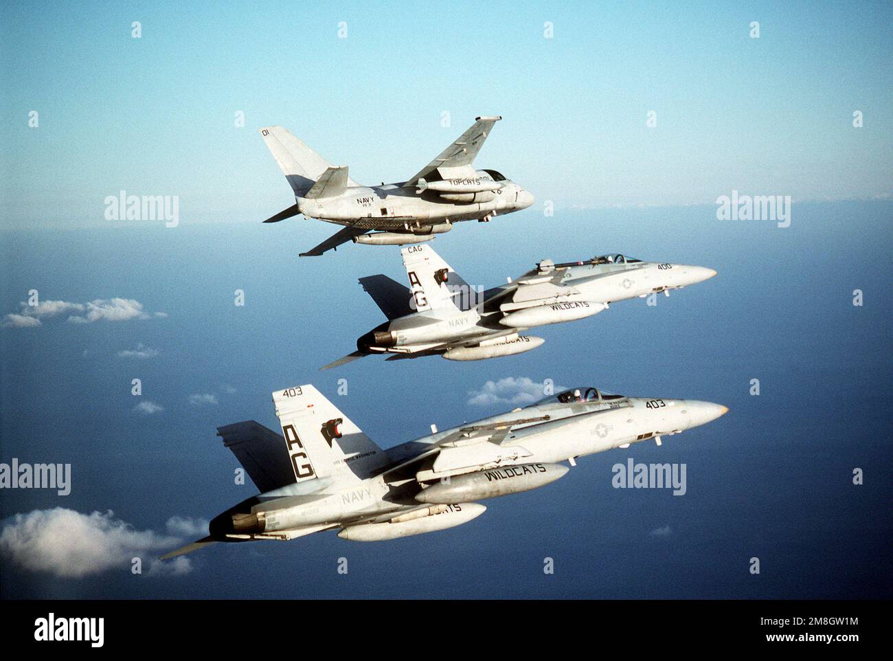 An air-to-air, right side view of two Strike Fighter Squadron 131 (VFA ...