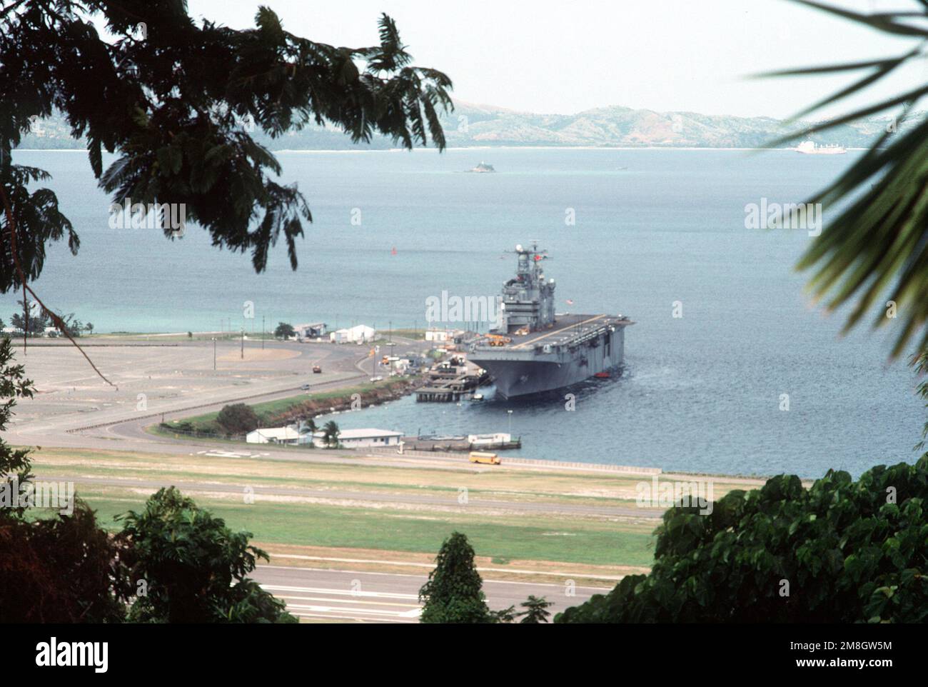 The amphibious assault ship USS BELLEAU WOOD (LHA-3) is docked at Leyte ...