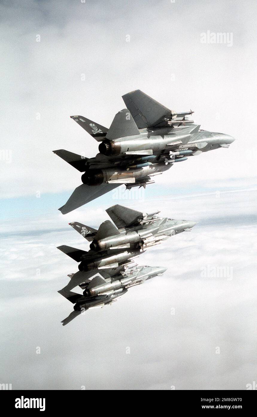 F-14A Tomcat aircraft of Fighter Squadron 84 (VF-84) bank to the left ...