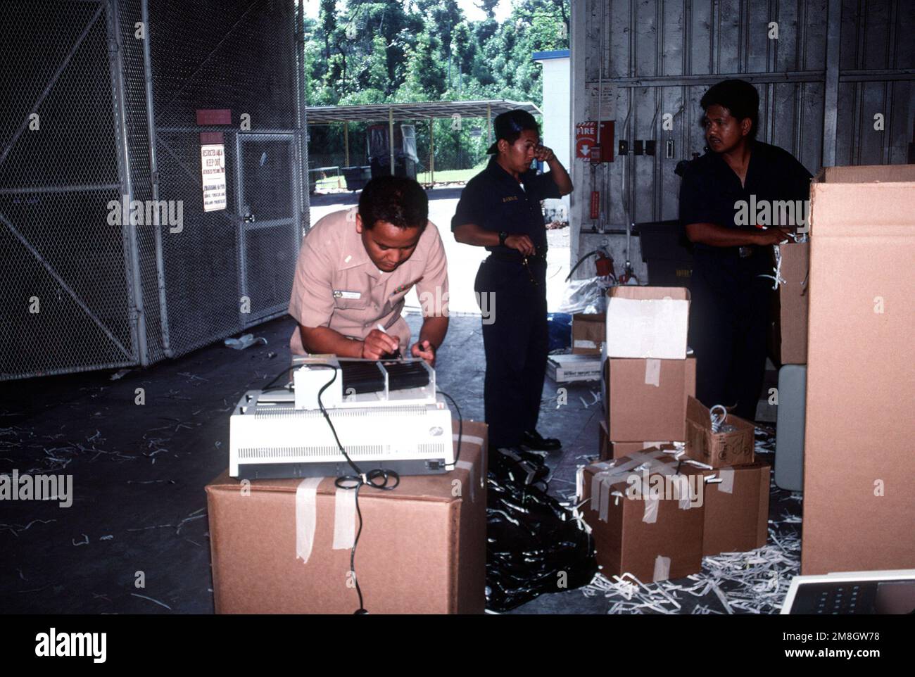 LT. j.g. Edilberto Salenga, equipment manager, takes inventory of ...