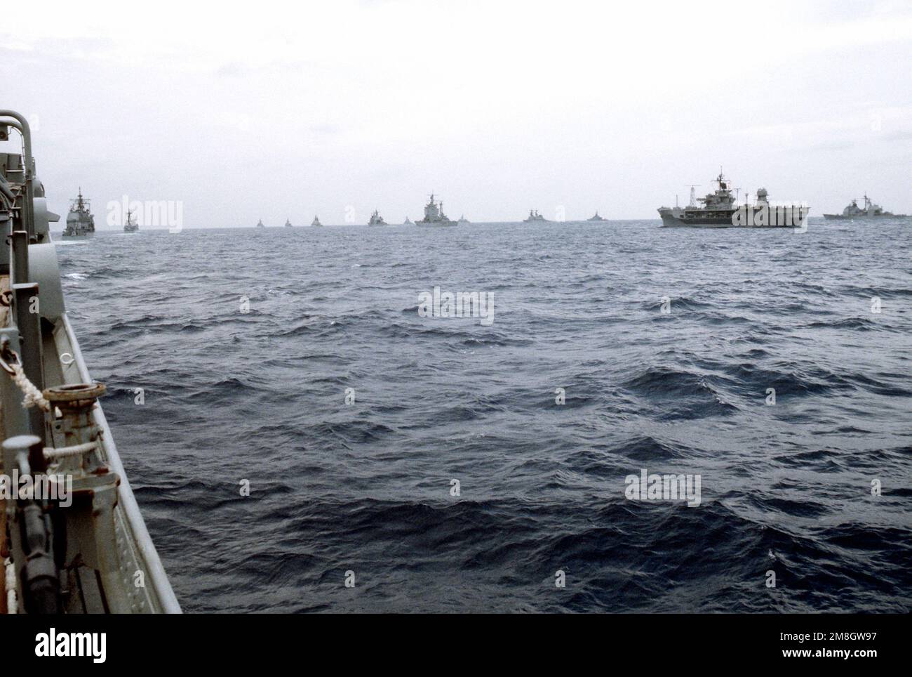 A group of U.S. and Japanese Maritime Self-Defense Force ships surround ...