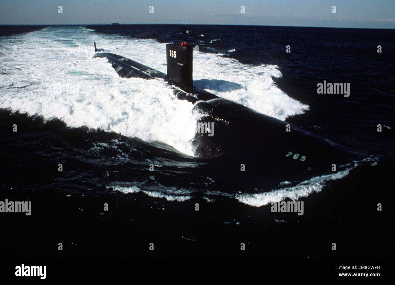 A starboard bow view of the nuclear-powered attack submarine USS ...