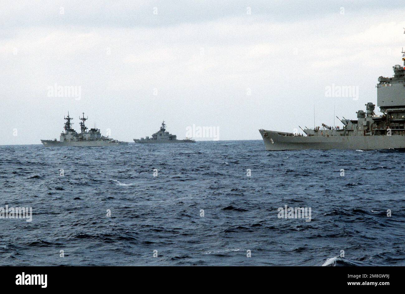 The destroyer USS ELLIOTT (DD-967) and the nuclear-powered guided ...